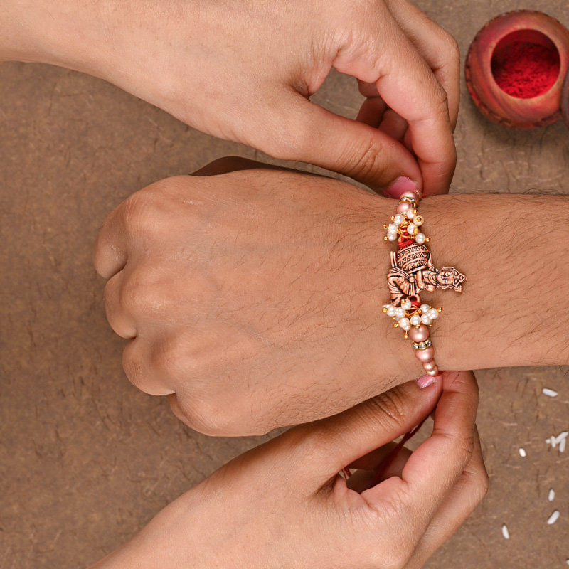 Buy Makhan Chor Rakhi at Rs.249 | FlowerAura