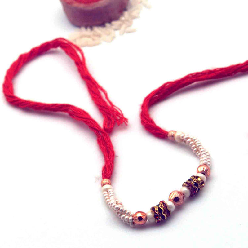 Send Rakhi to New York Online | Rakhi Delivery in New York | FlowerAura